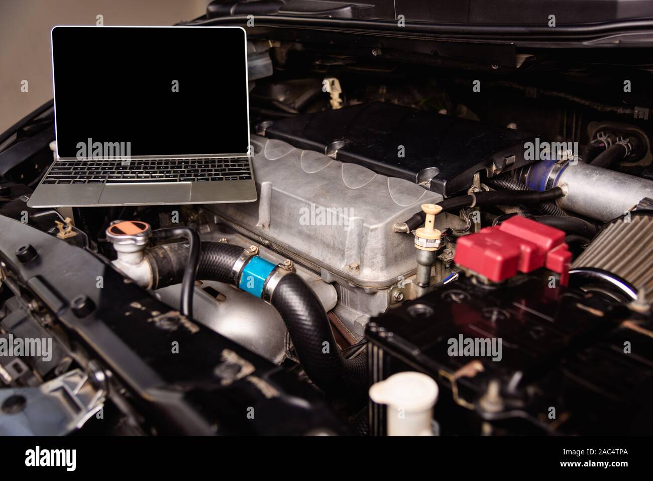 Laptop computer on car mechanic engine for service at workshop Stock ...