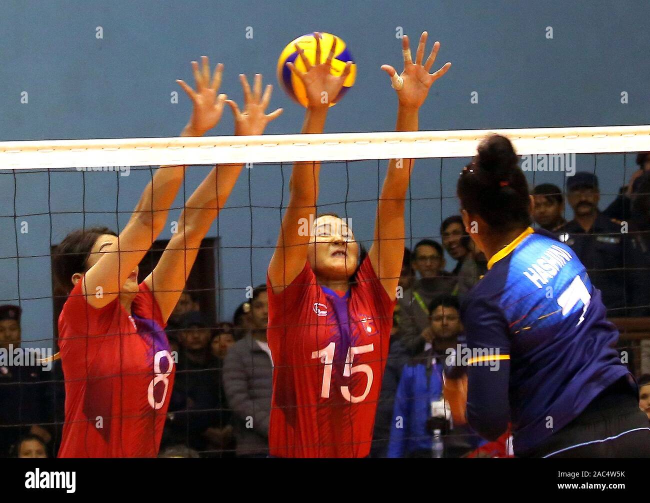 Kathmandu, Nepal. 30th Nov, 2019. Nepal's Reshma Bhandari (L) and Safia Pun (C) try to block ...