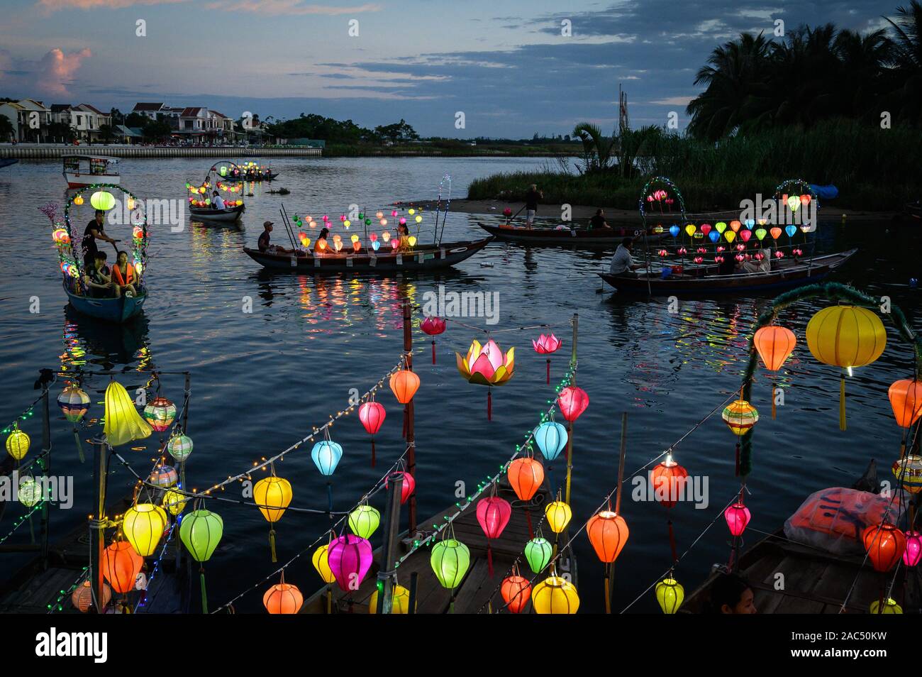 Boats and their brightly lit lanterns at dusk, Hoi An, Vietnam Stock ...