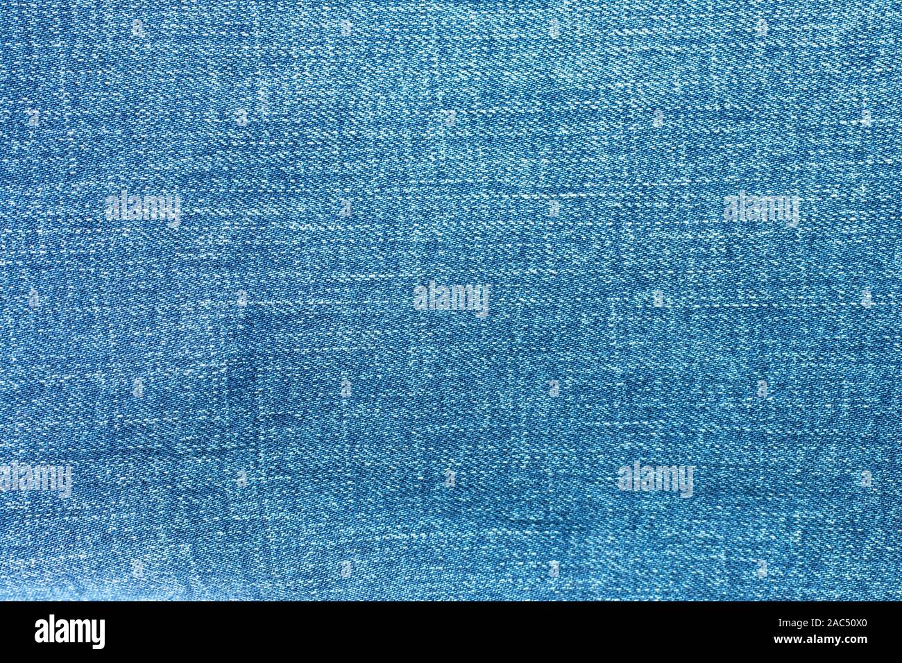 Blue color denim jeans clothes textured background Stock Photo - Alamy