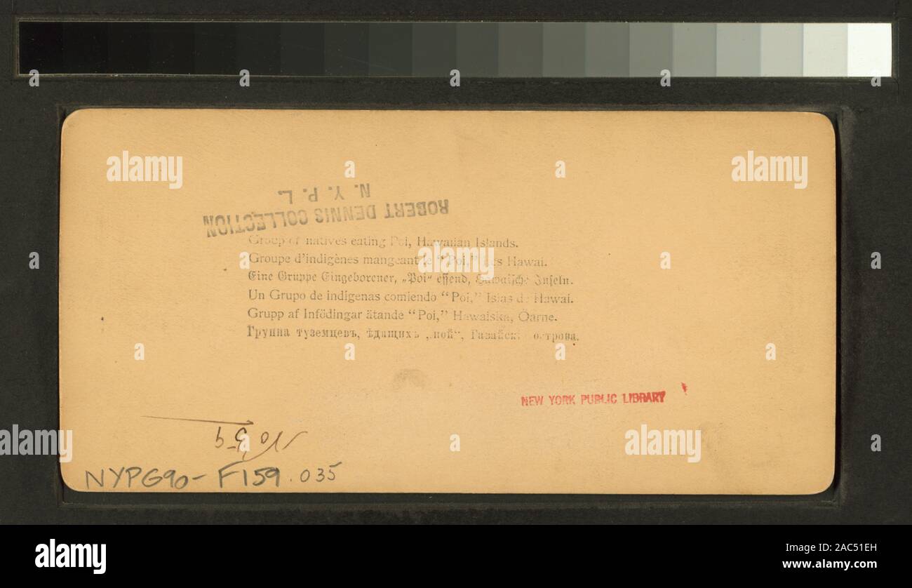 Group of natives eating poi (in front of thatched hut), Hawaiian ...