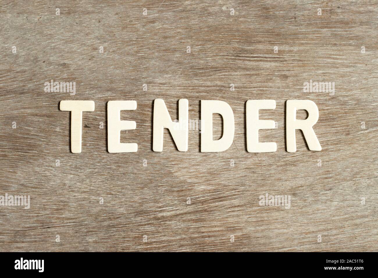 Alphabet letter in word tender on wood background Stock Photo - Alamy