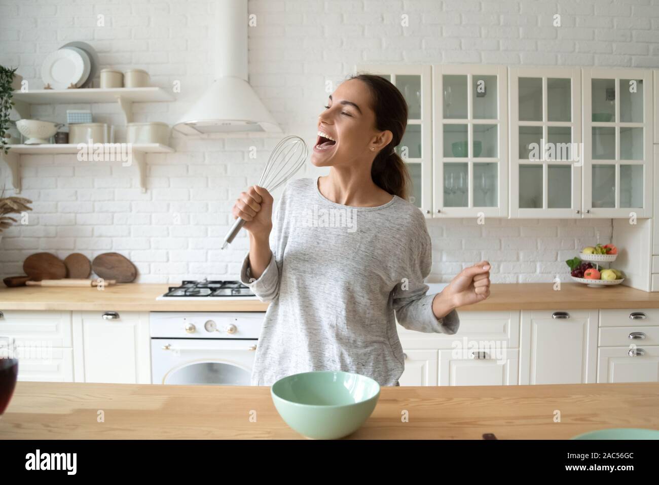 Happy funny woman singing in hi-res stock photography and images - Alamy