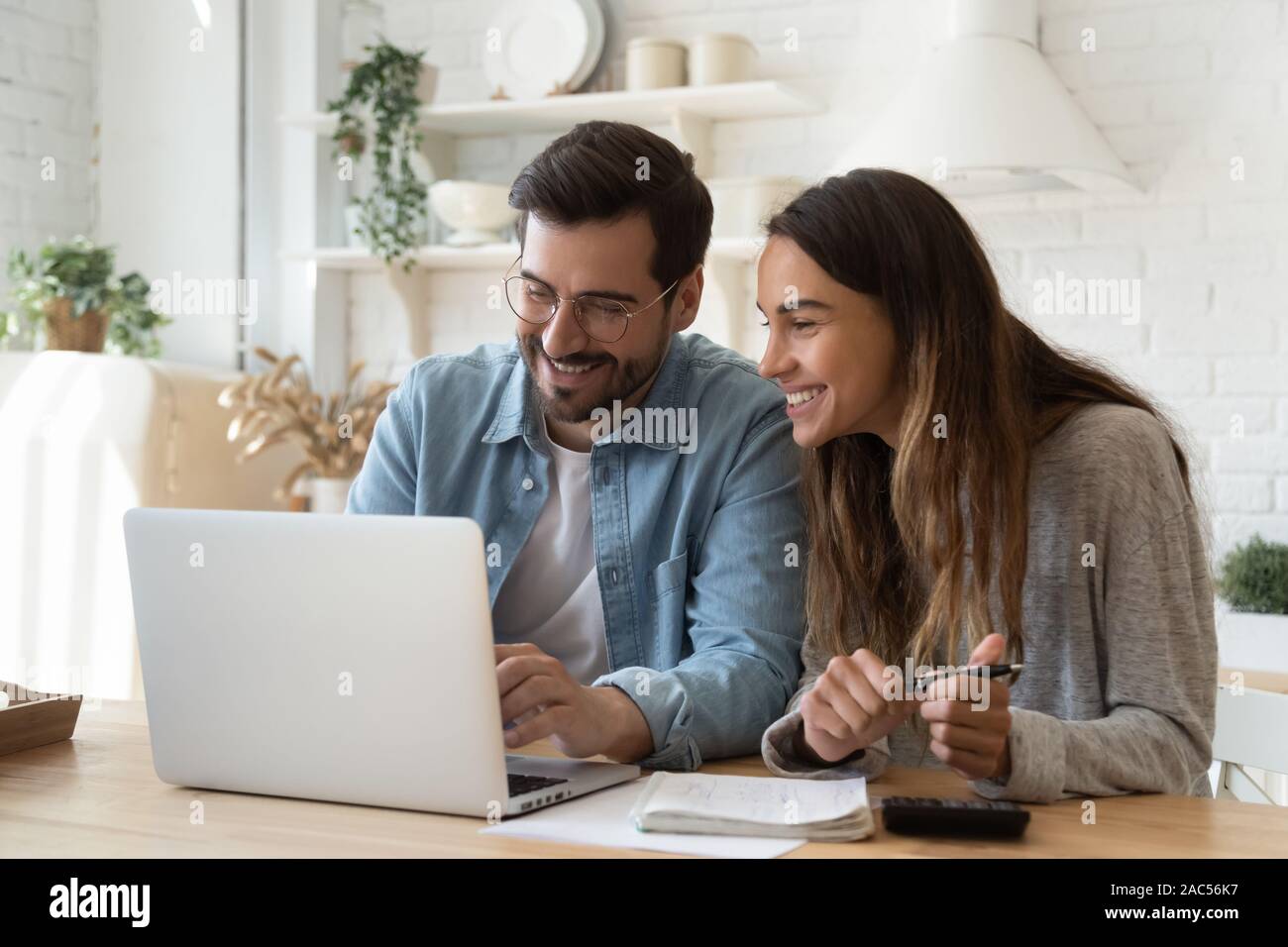 Young family paying bills together hi-res stock photography and images ...