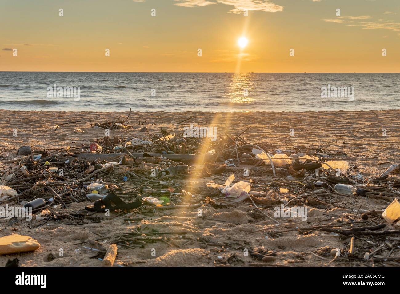 Trash piles up during sunset on the beach in Goa, India Stock Photo - Alamy