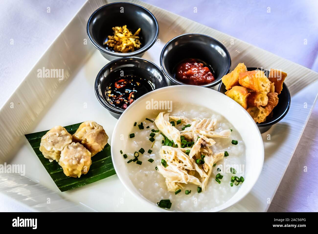 chinese rice porridge with shredded chicken and spring onions with ...