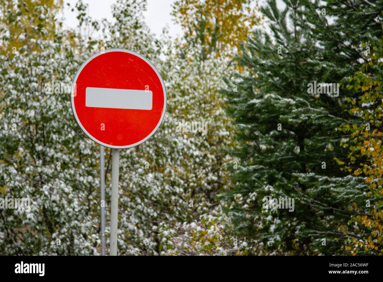 Road up. Prohibitory red road sign on a background of snowy trees Stock ...
