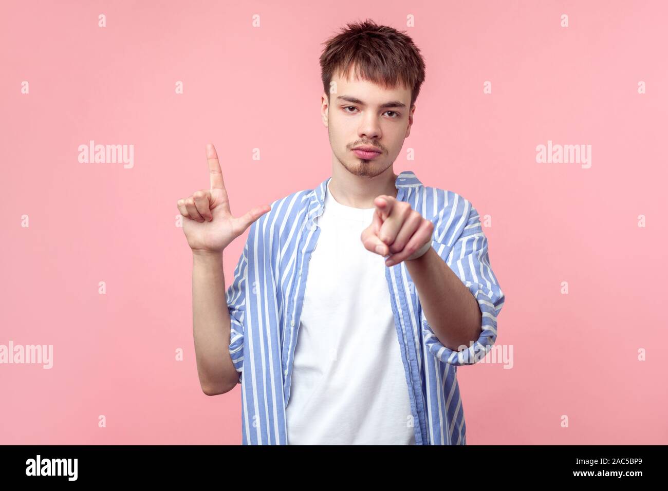You are loser! Portrait of bossy brunette man with small beard and ...