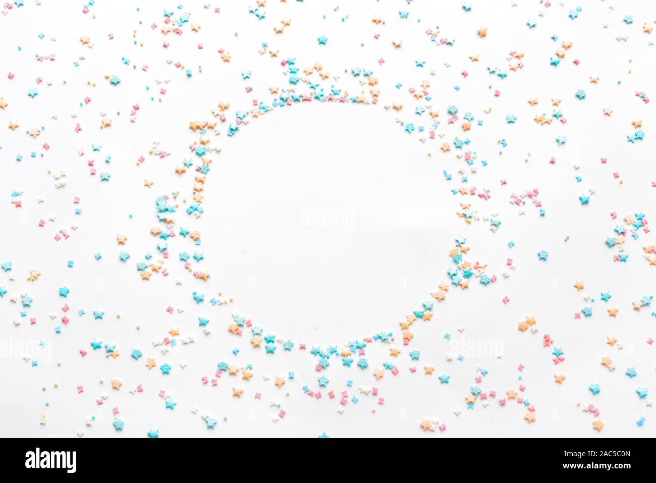 Colorful Pastel Sprinkles on white background, top view, round copy ...