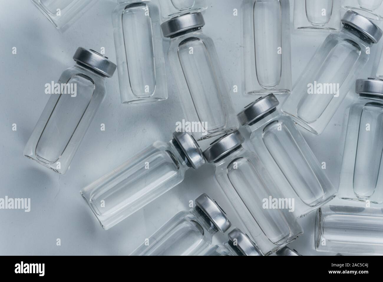 Glass medical ampoule vial for injection. Medicine is dry white drug ...