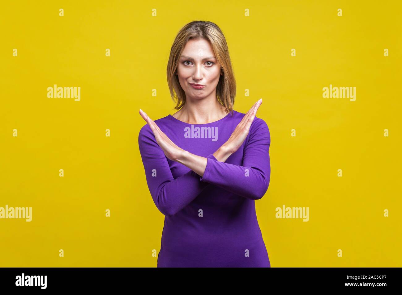 There is no way. Portrait of woman in elegant purple dress standing ...