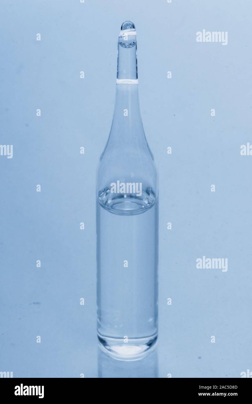 Glass medical ampoule vial for injection. Medicine is dry white drug ...