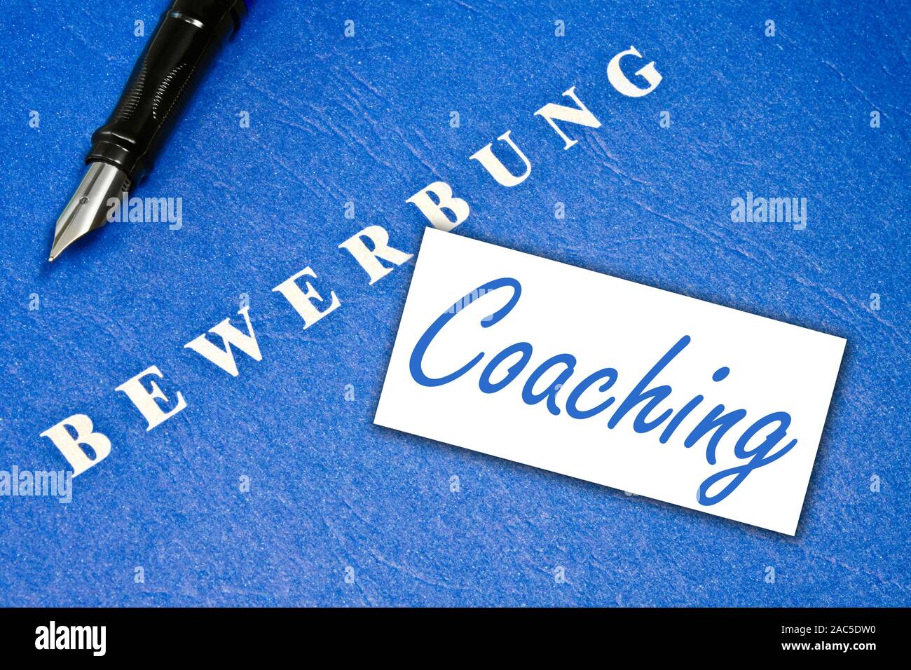 File and German: Job application coaching Stock Photo - Alamy