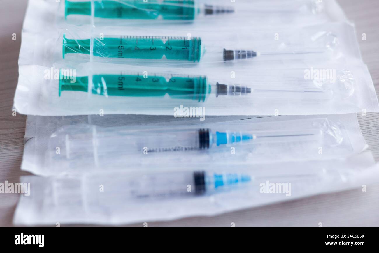 new disposable injection syringes in the package, close-up, selective ...