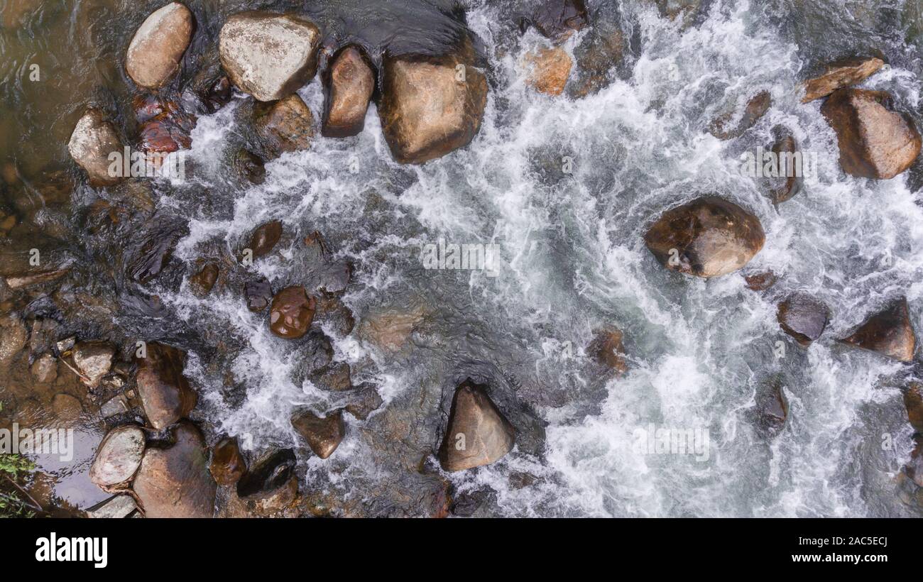 Aerial photo of river with rock Stock Photo - Alamy
