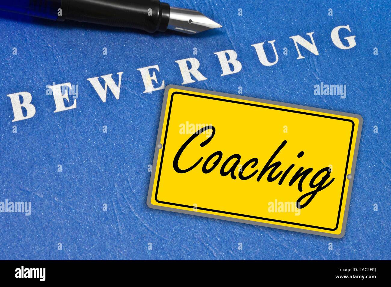 File and German: Job application coaching Stock Photo - Alamy