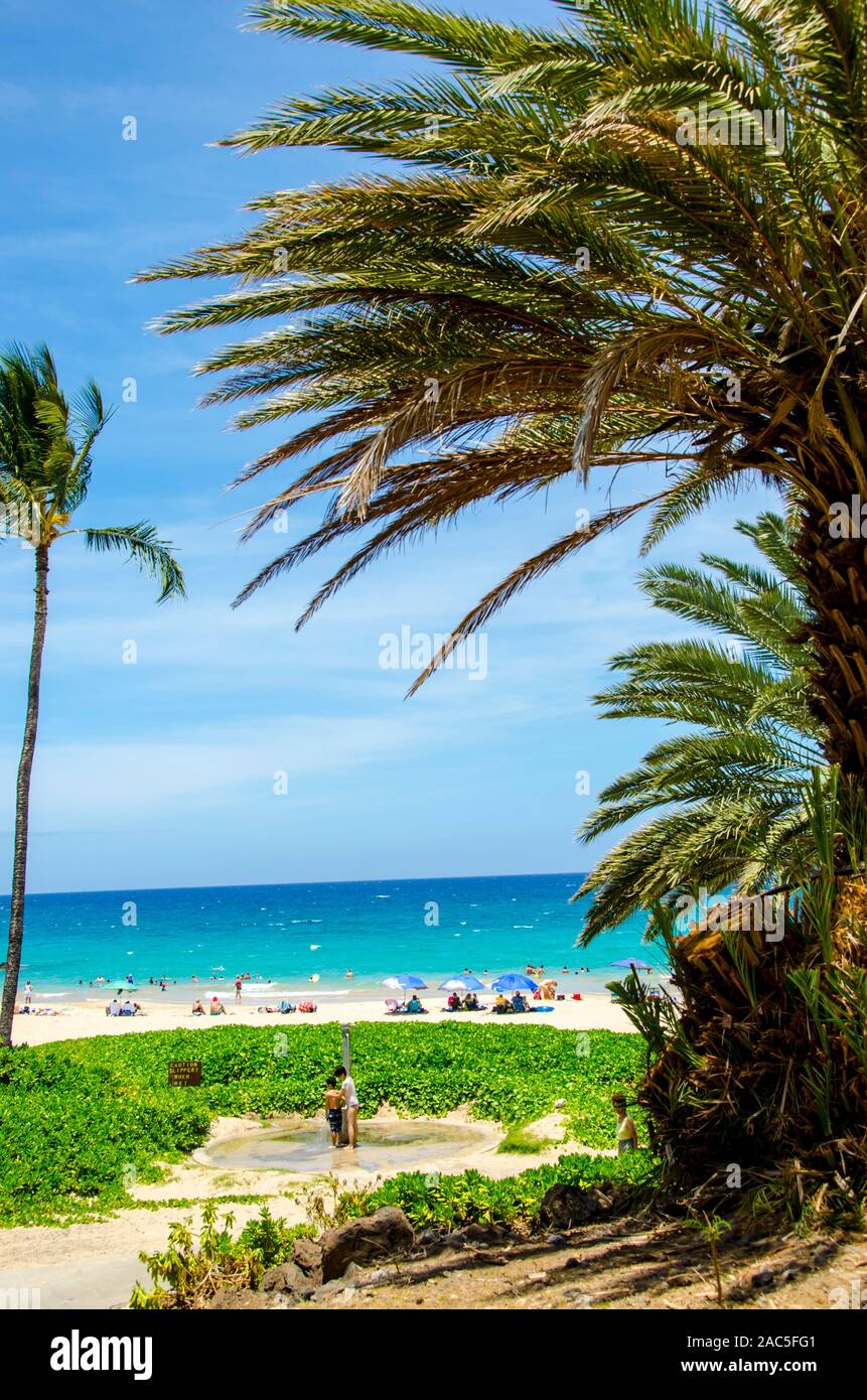 People enjoying a sunny day at Hapuna Beach, along the Big Island's ...