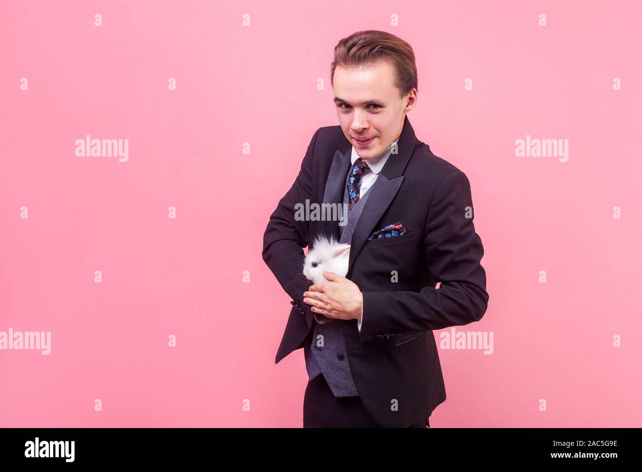 Smirking man in suit hi-res stock photography and images - Alamy