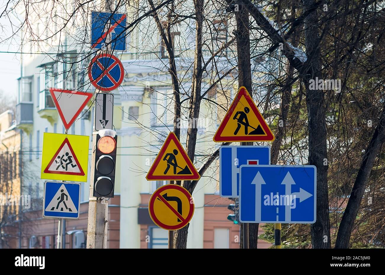 a large number of road signs, symbols of detours, road repairs near the ...