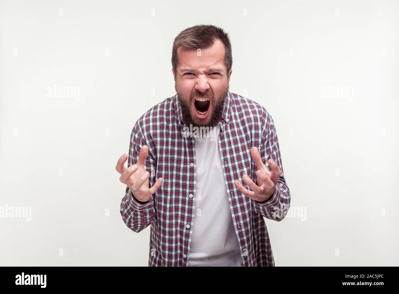 Angry young bearded brunette man hi-res stock photography and images ...