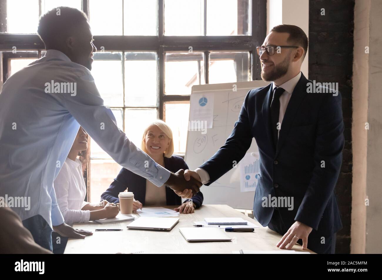 African american colleagues congratulating team hi-res stock ...
