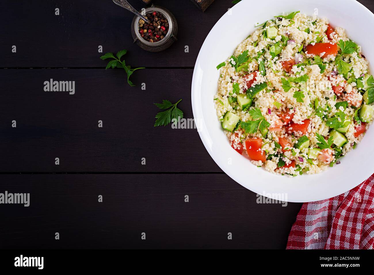 Traditional Lebanese Salad Tabbouleh. Couscous with parsley, tomato ...