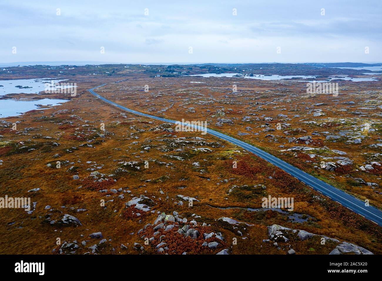 Aerial view of road in rough landscape on Lettermullan peninsula, taken ...