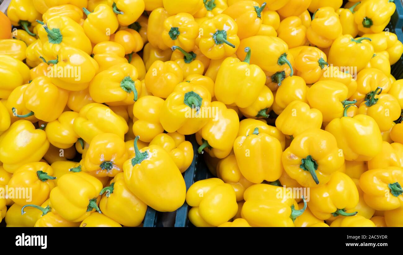 Pepper background. yellow peppers close up Stock Photo - Alamy