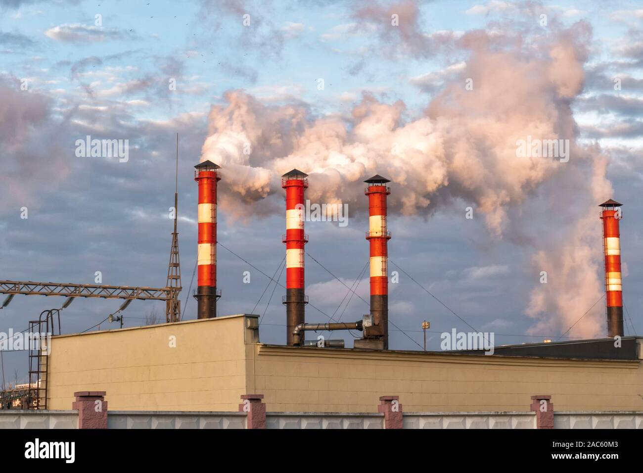 Smoking pipe factory. smoke from pipes against the sky Stock Photo - Alamy