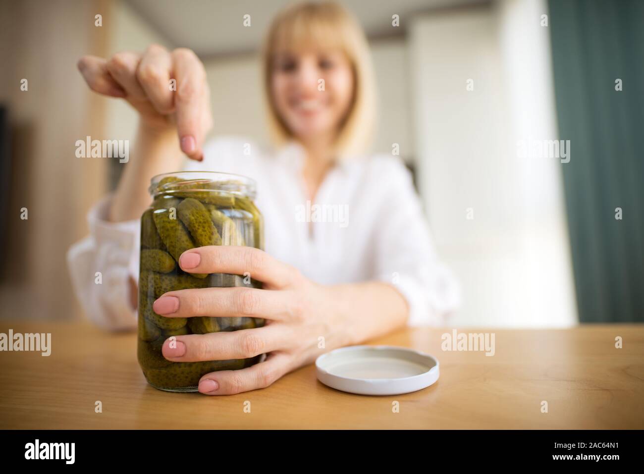 Woman holding jar pickles hi-res stock photography and images - Alamy