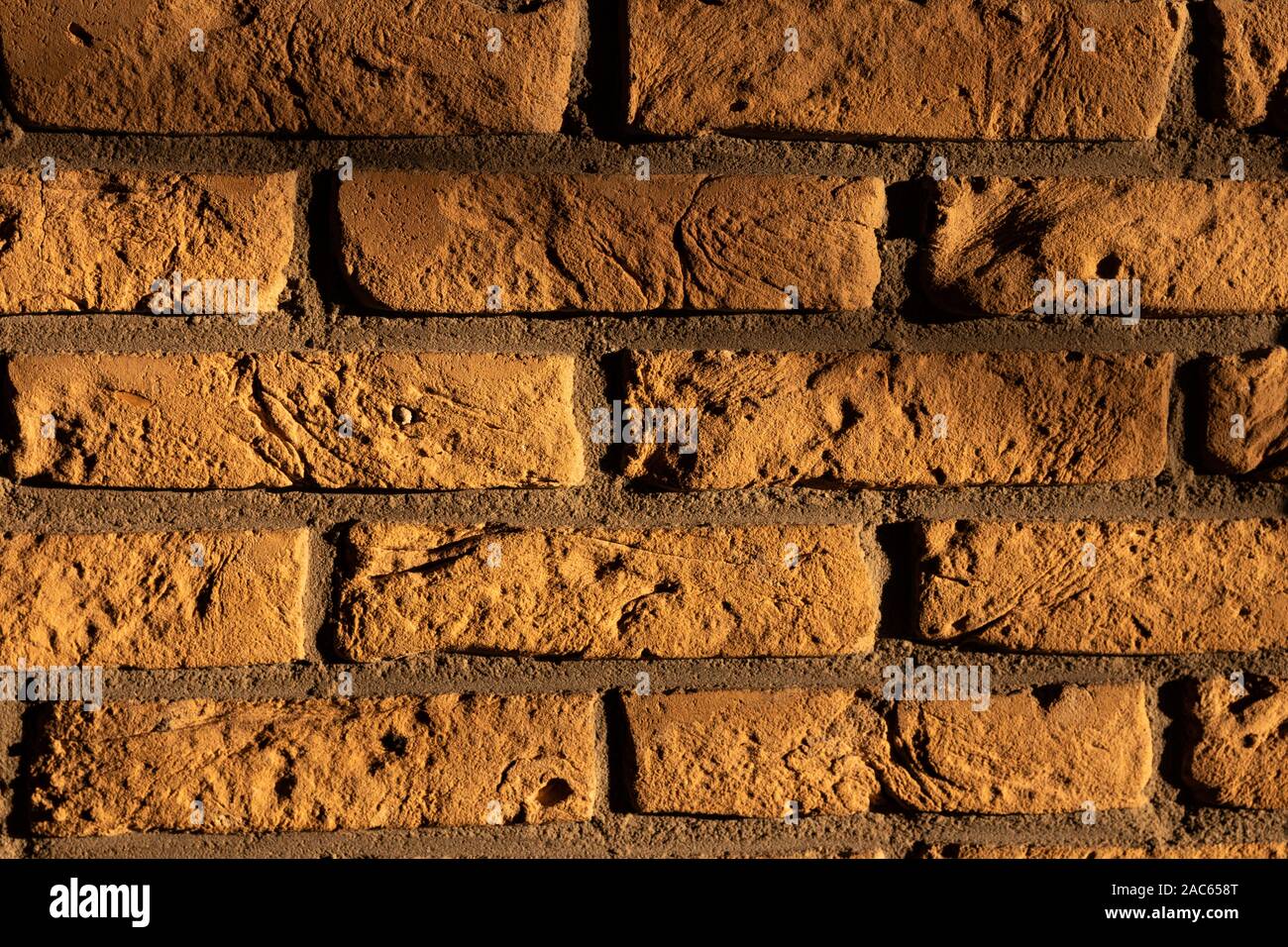 Shady brick wall in sunlight Stock Photo - Alamy