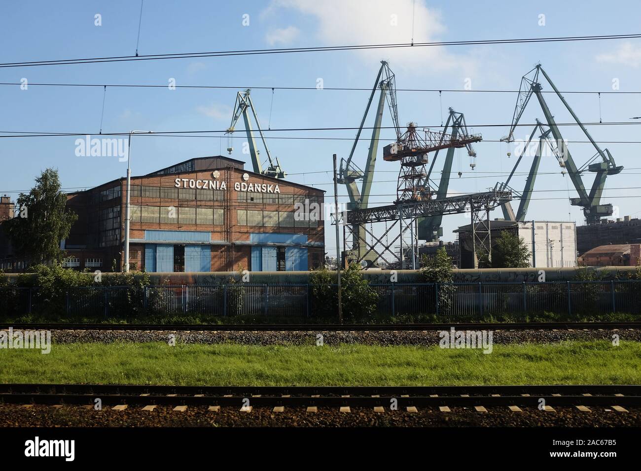 Gdansk Shipyard landscape - shipyard hall and cranes Stock Photo - Alamy