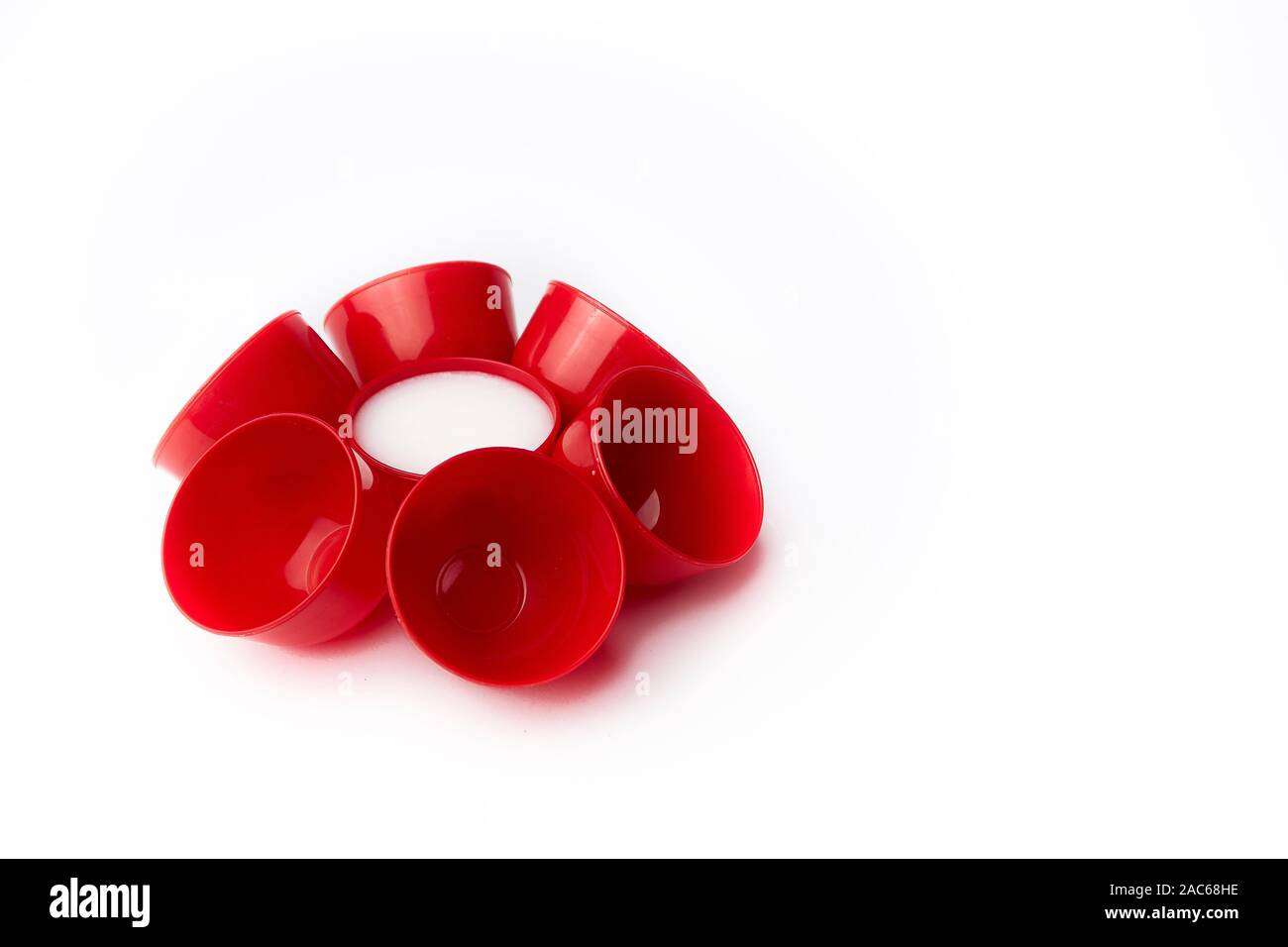 Set of Red cups on table isolated on white background Stock Photo - Alamy