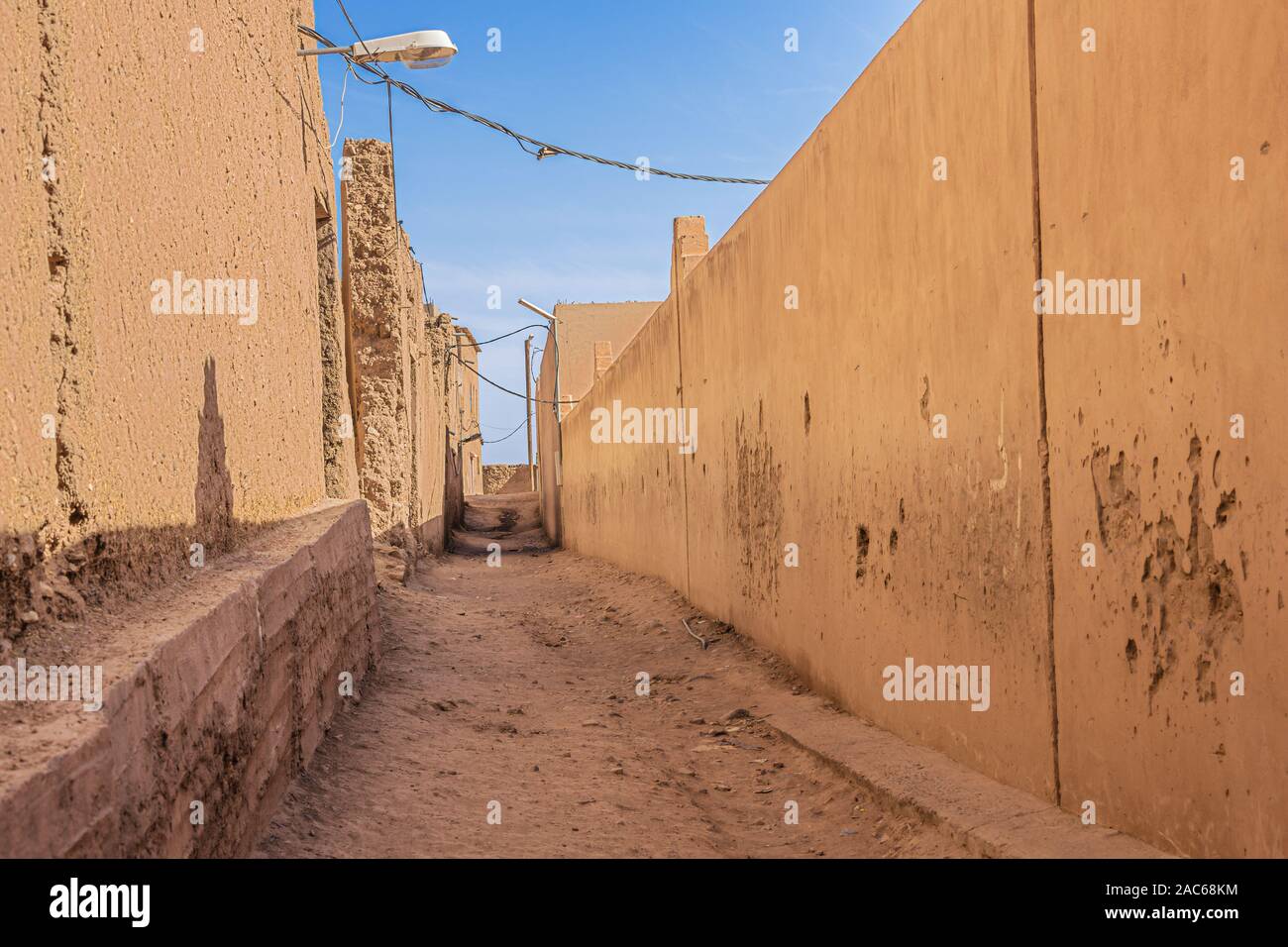Unpaved side street in Tamegroute a village in the Draa Valley Stock ...