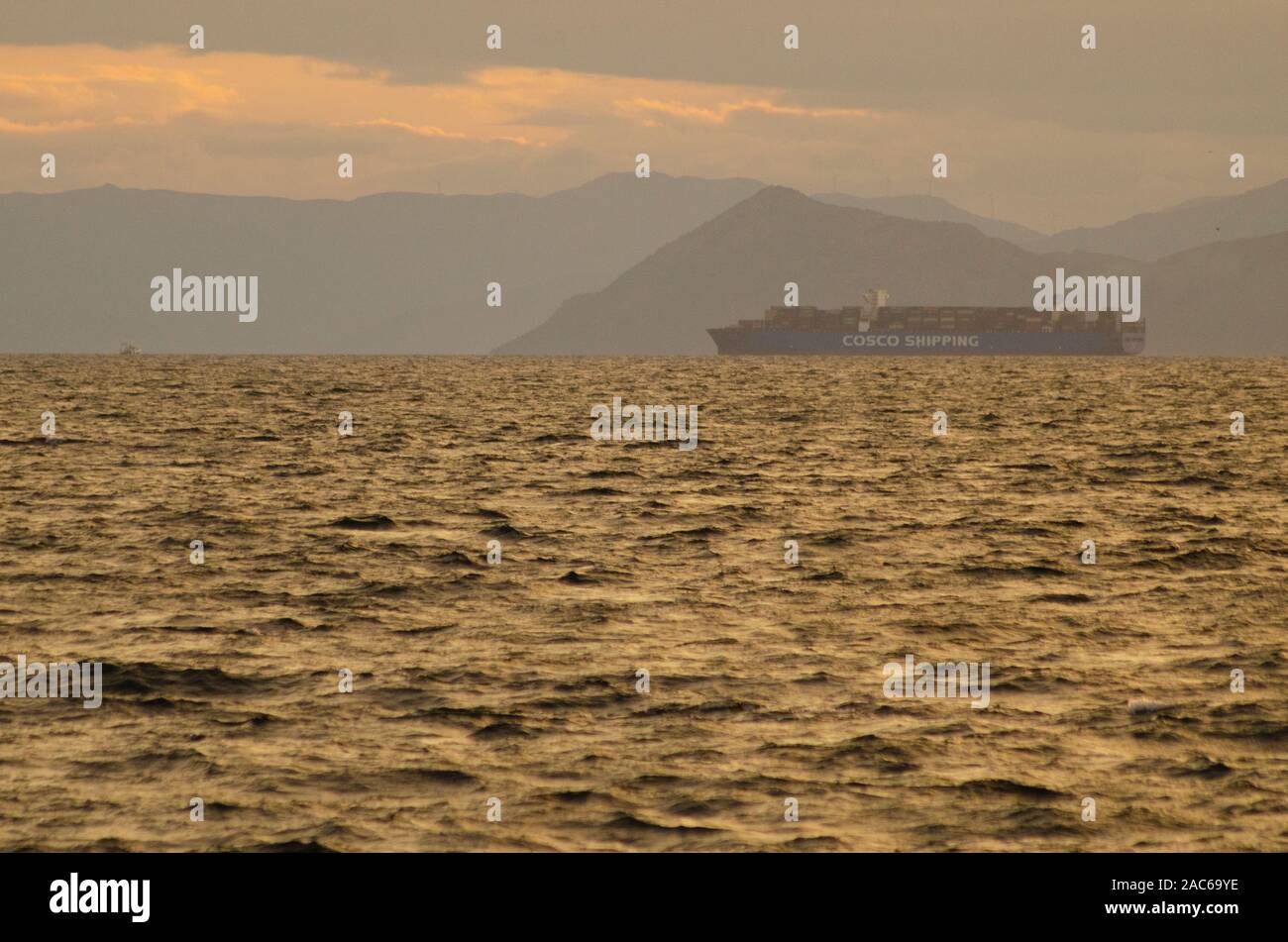 A large Cosco container ship departs from the Port of Pireaus Athens ...