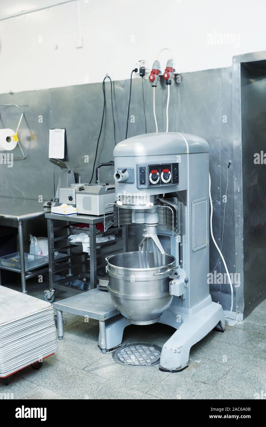 Heavy duty dough mixing machine in professional food processing plant ...
