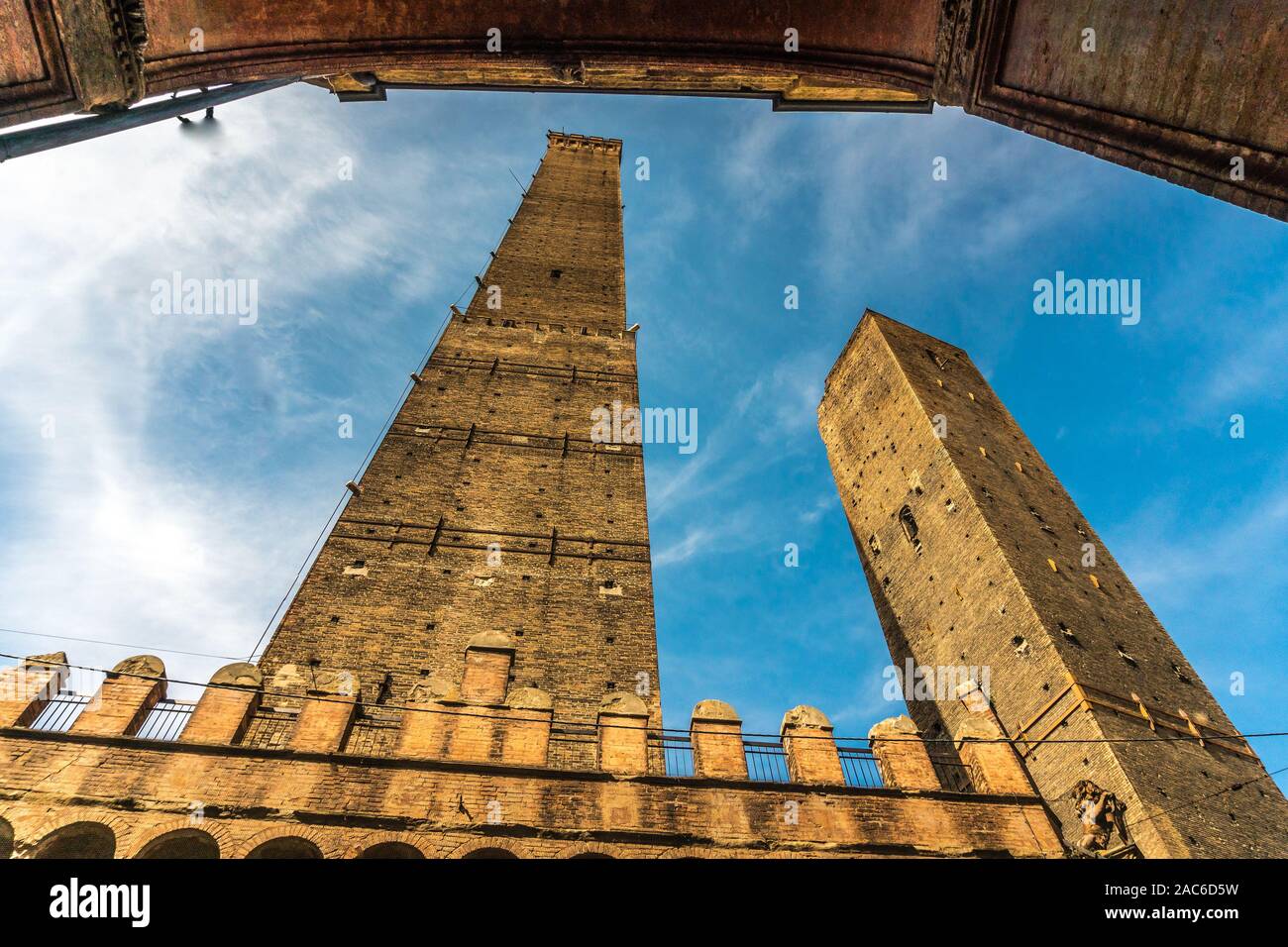 View towards the towers of Bologna trough an arc, typical for the city ...