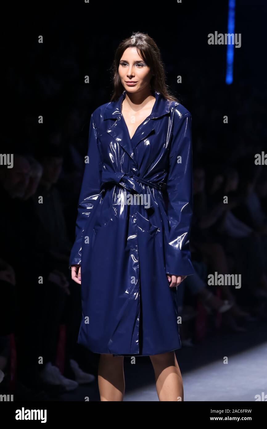 Woman wearing plastic raincoat hi-res stock photography and images - Alamy