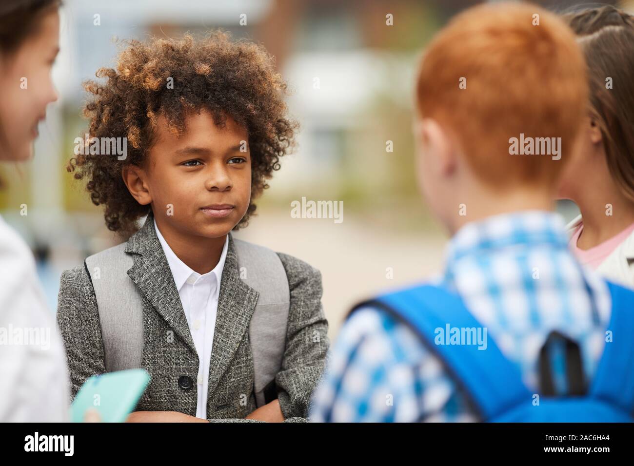 Boys talking school uniform hi-res stock photography and images - Alamy
