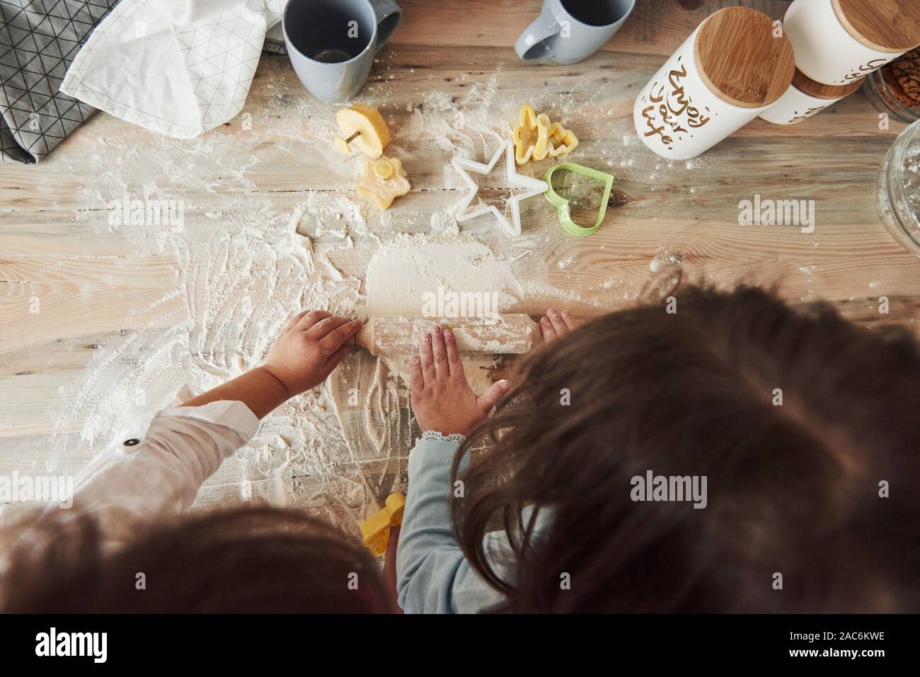 Conception of cooking. Top view of kids learning to prepare food from ...