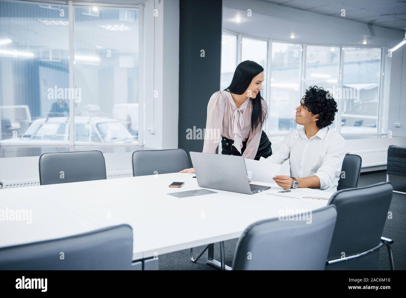 Deal between international people. Cheerful coworkers in a modern ...