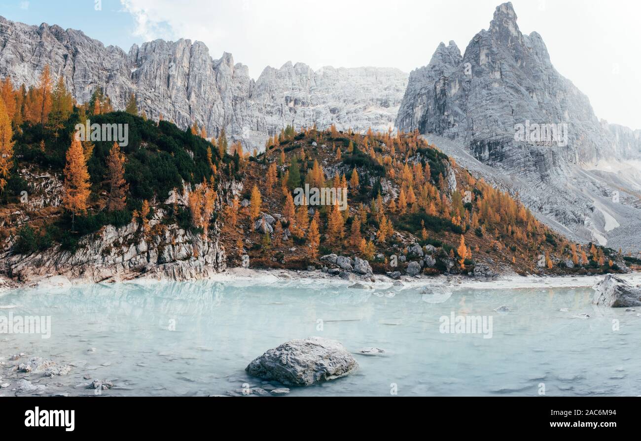 Great hills and cliffs. Autumn day in the majestic mountains. Yellow ...