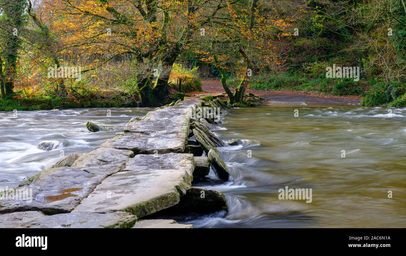 Exmoor, UK - November 15, 2019: The medieval clapper bridge over the ...