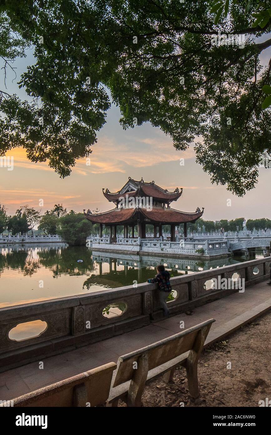 Child playing in front of the shrine Den Do Stock Photo - Alamy