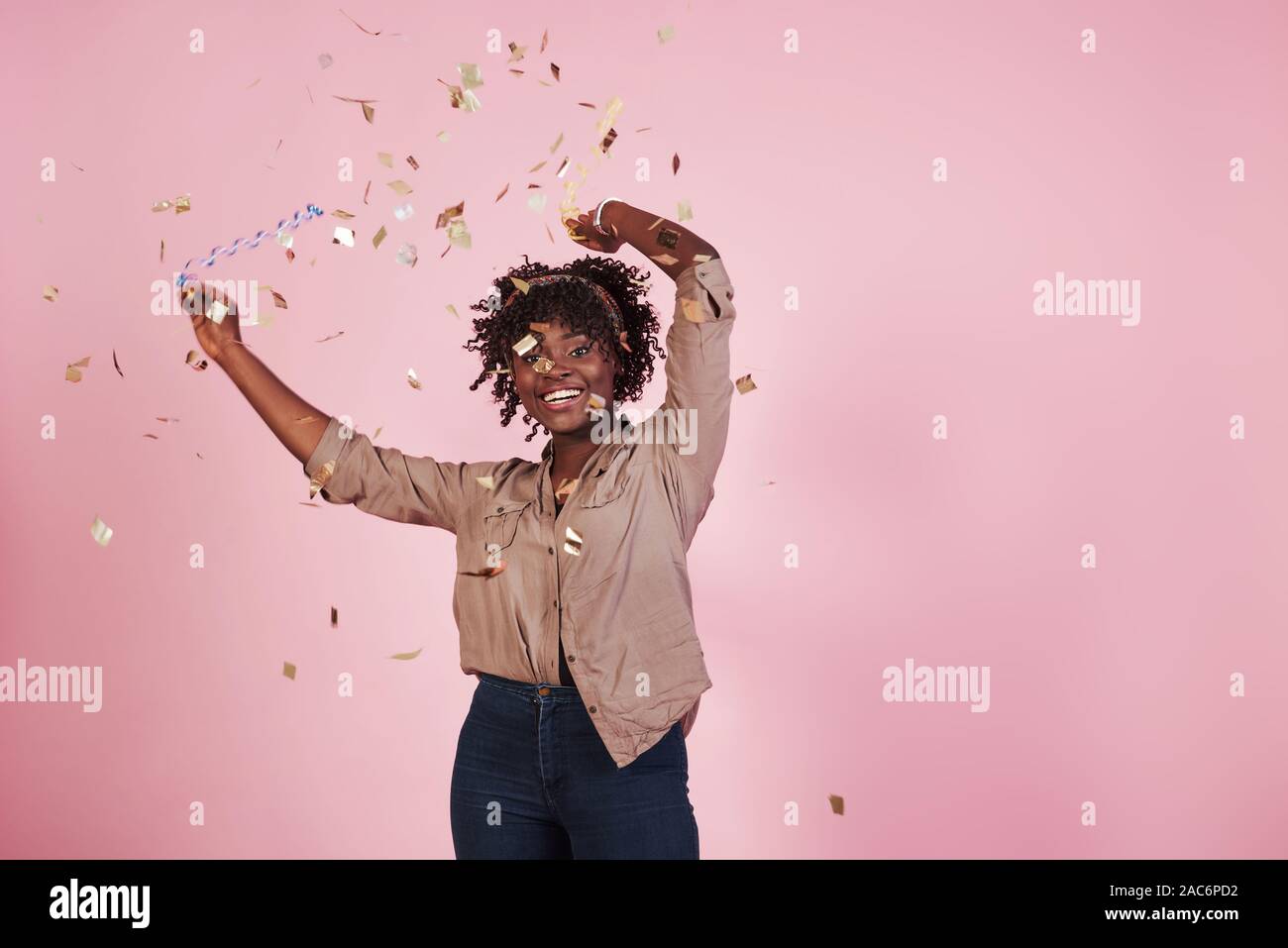 Party conception. Throwing the confetti in the air. African american ...