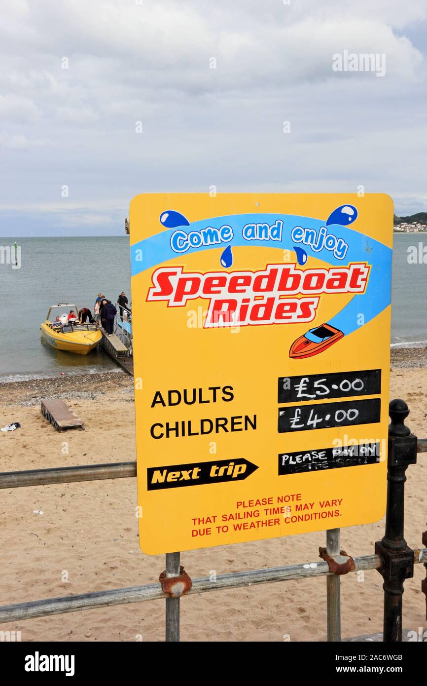 Sign advertising Speedboat Rides, Llandudno Stock Photo - Alamy
