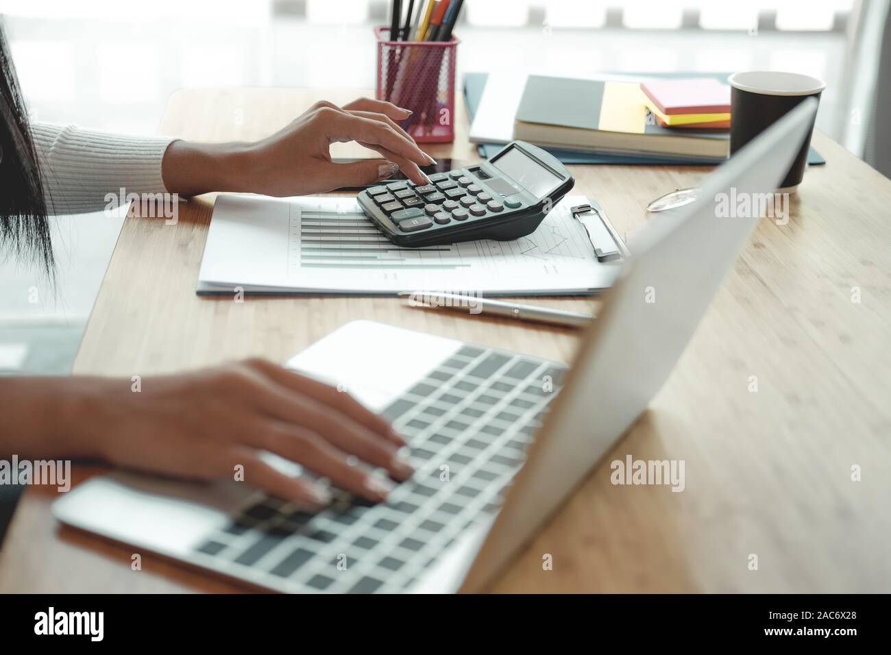 financial adviser working with calculator at office. accountant doing ...