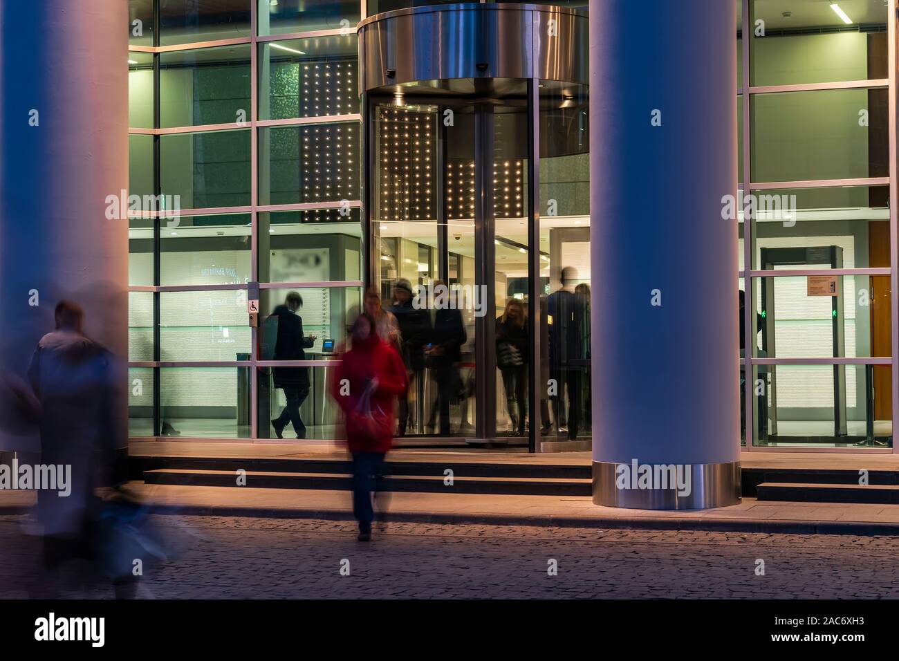 The movement of people at the entrance to modern building Stock Photo ...