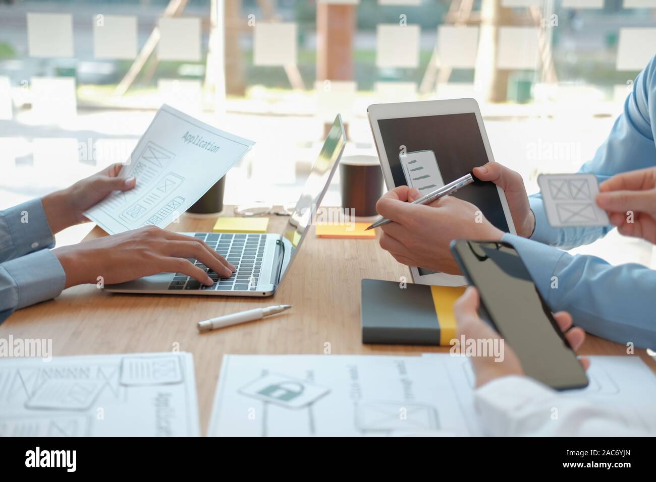 user experience UX designer designing web on smart phone layout. UI ...