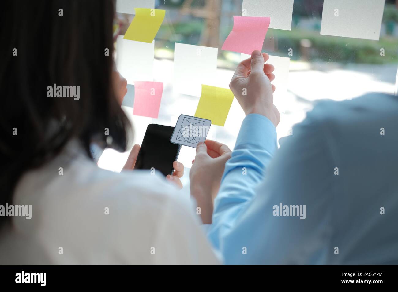 user experience UX designer designing web on smart phone layout. UI ...